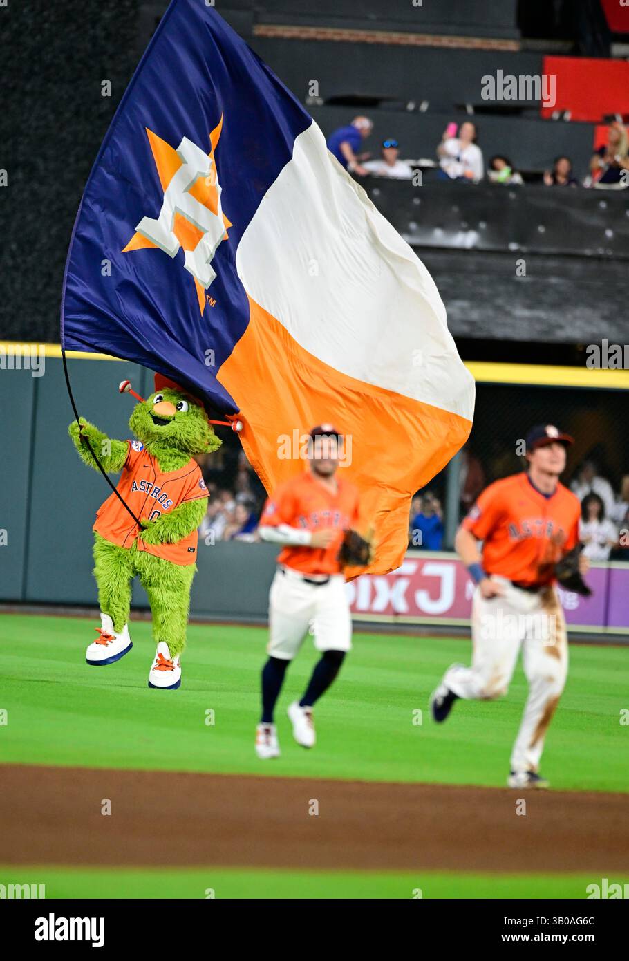 Houston Astros mascot Orbit waves to victory flag after the MLB game between the San Diego ...