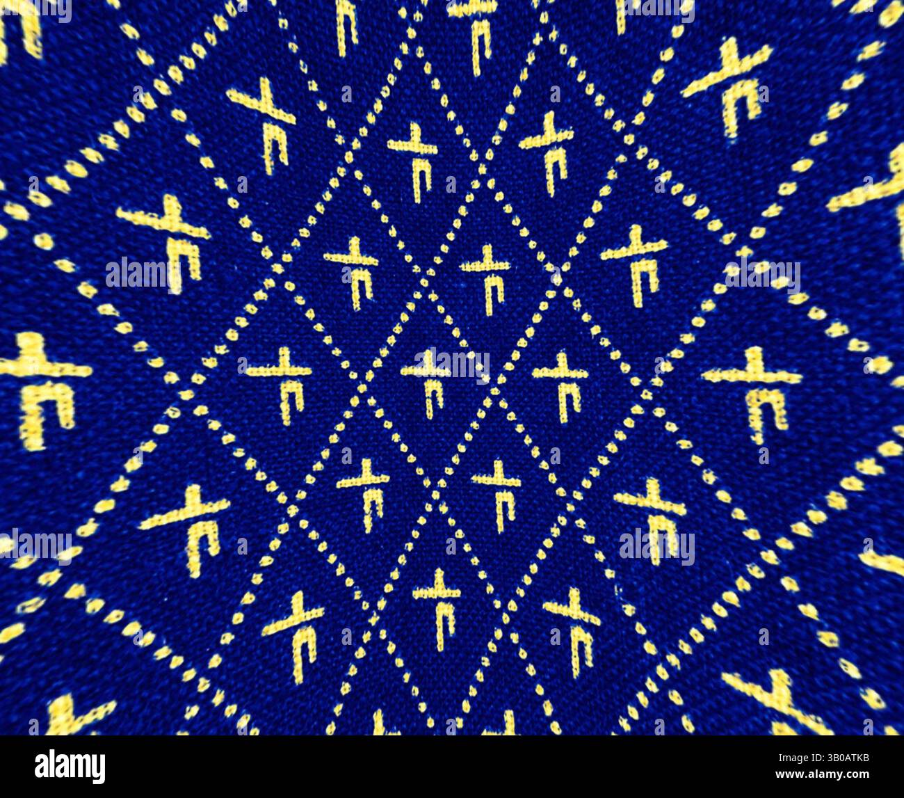A close-up of a vibrant textile featuring a repeating diamond pattern ...