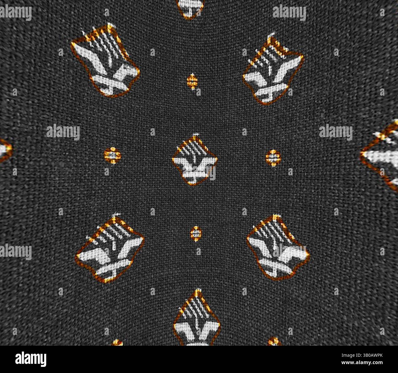 A textured fabric displays a repetitive pattern of stylized hands and ...