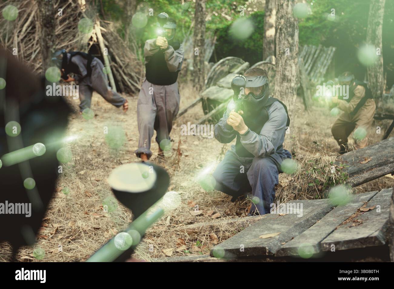 Tactical paintball team fighting on outdoor location Stock Photo - Alamy