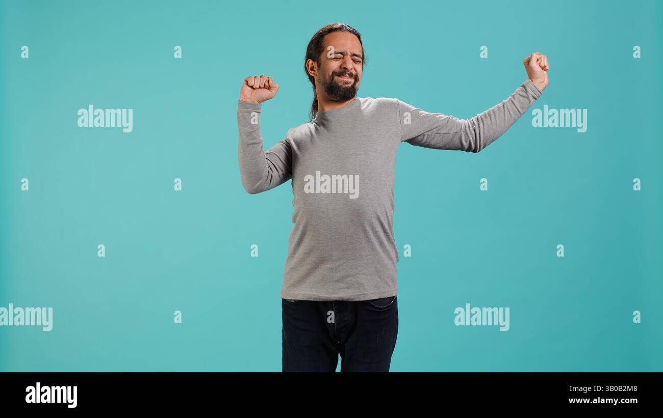 Portrait of man stretching his body, experiencing fatigue and tension ...