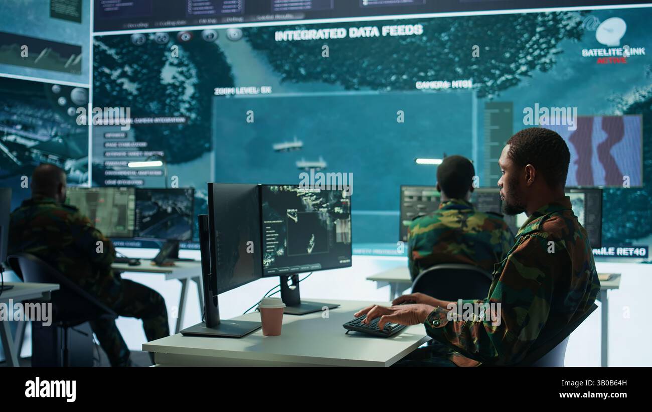Team of military specialists overseeing surveillance activity by using ...