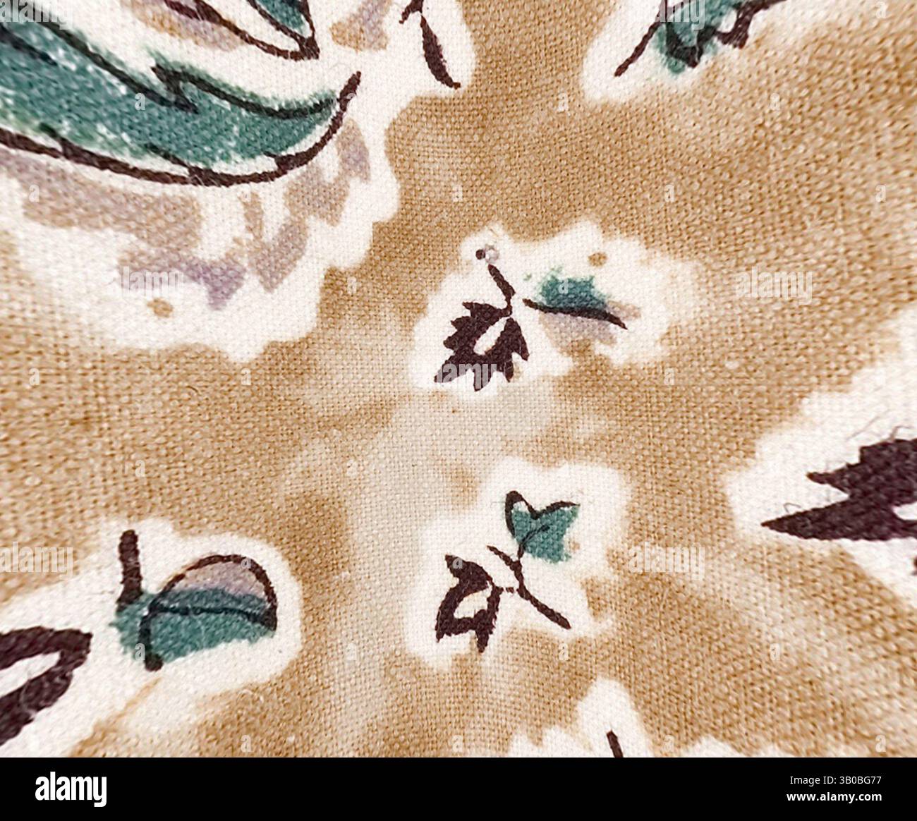 A textured fabric featuring a floral pattern with earthy tones and ...