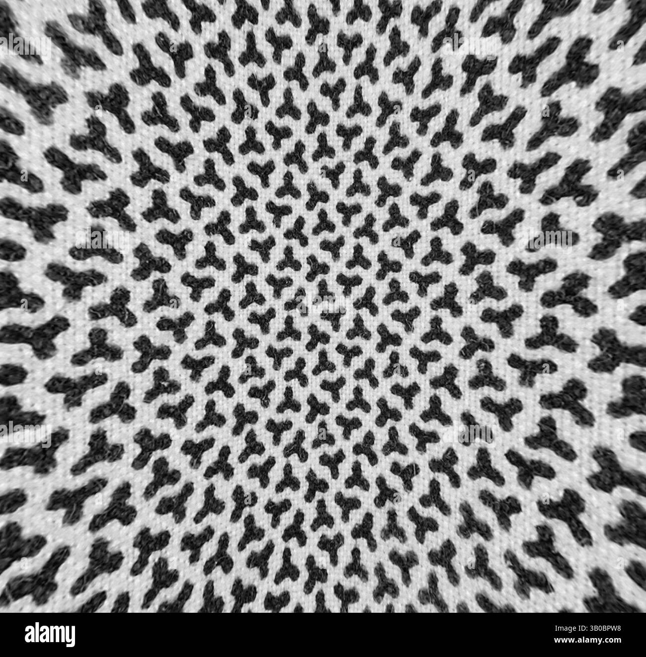 A dense pattern of small, repeating shapes creates a visually ...