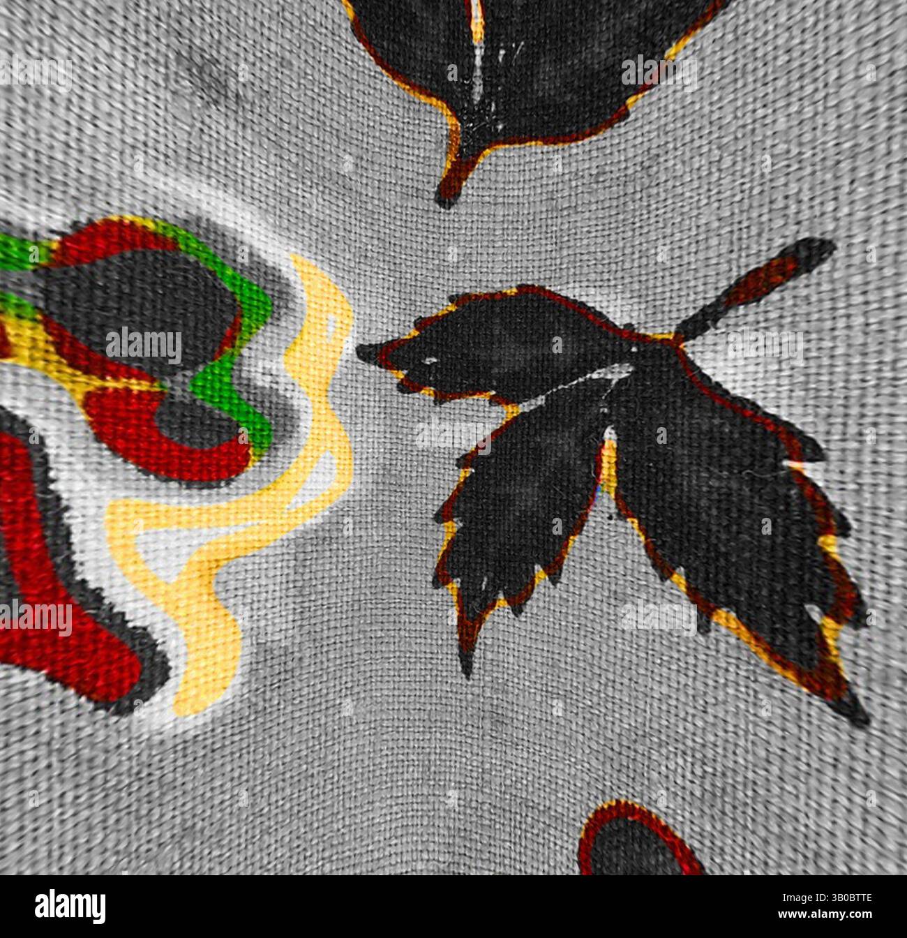 A textured fabric featuring vibrant, colorful patterns of leaves and ...