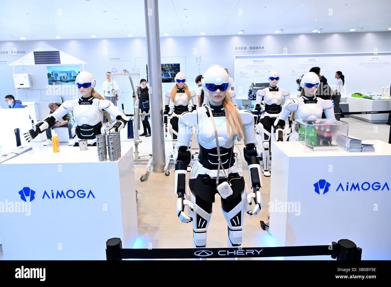 Visitors are viewing the exhibited products such as vehicles and robots ...