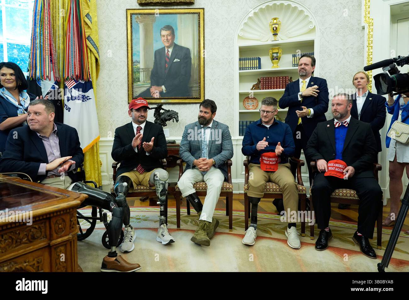Michael and Sarah Verardo, and other guests listen as President Donald ...