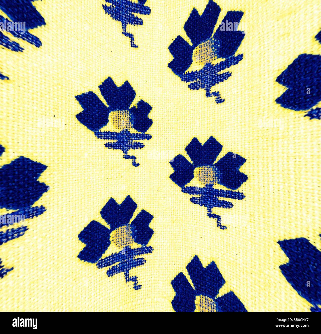 A vibrant pattern features large floral designs in deep blue set ...