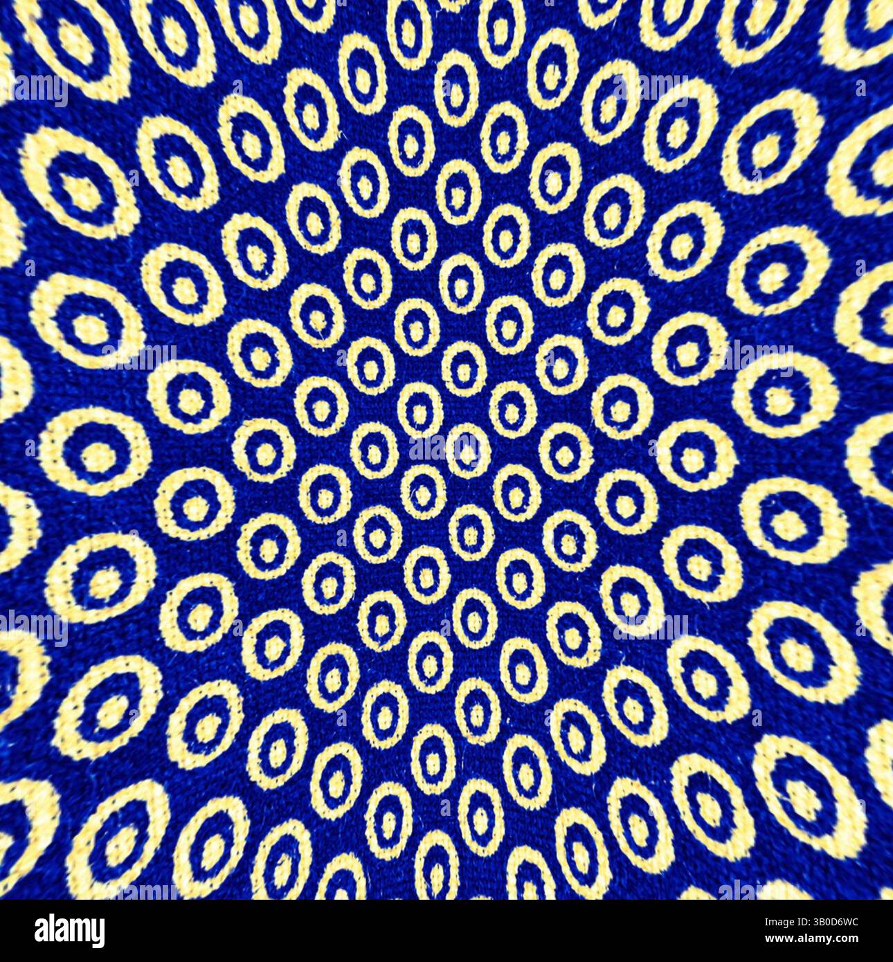 A vibrant pattern of concentric circles in yellow and blue creates a ...