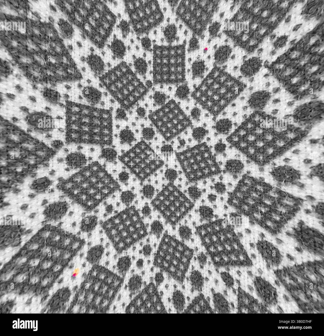 An intricate pattern features geometric shapes arranged in a ...
