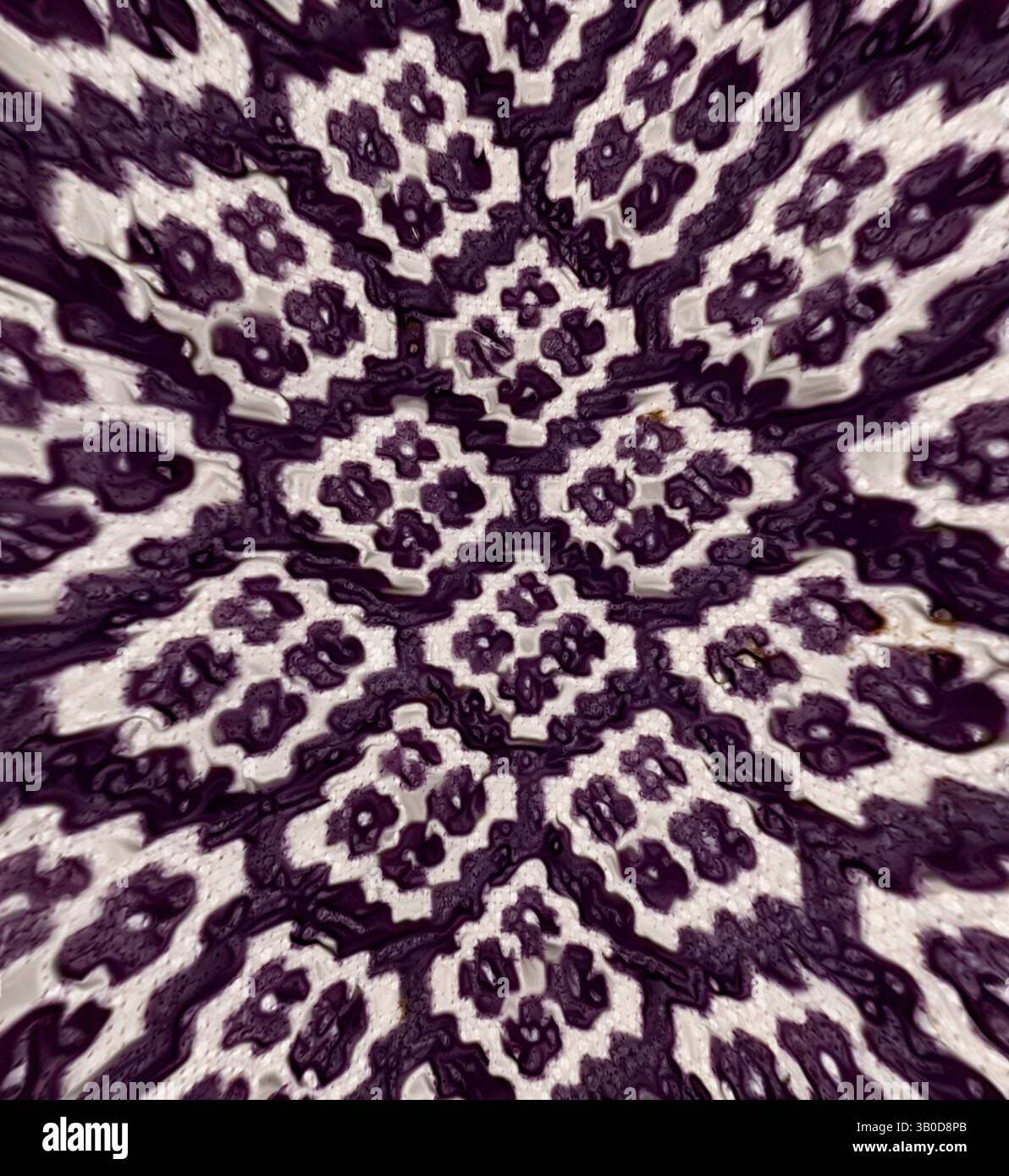 An abstract pattern featuring a swirling design with floral motifs in ...