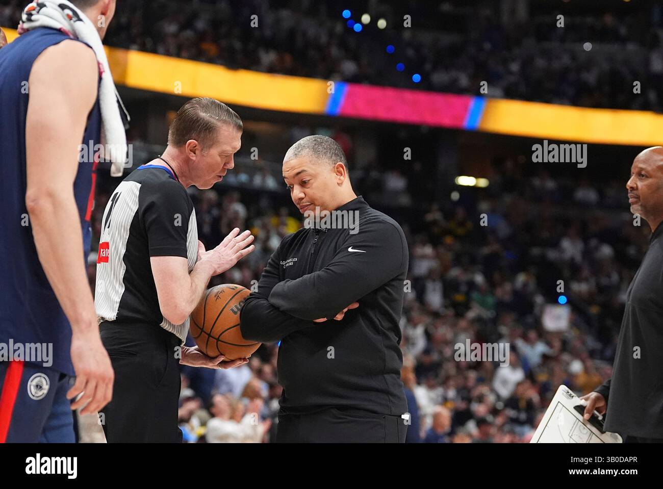 Los Angeles Clippers head coach Tyronn Lue () confers with referee Ed ...