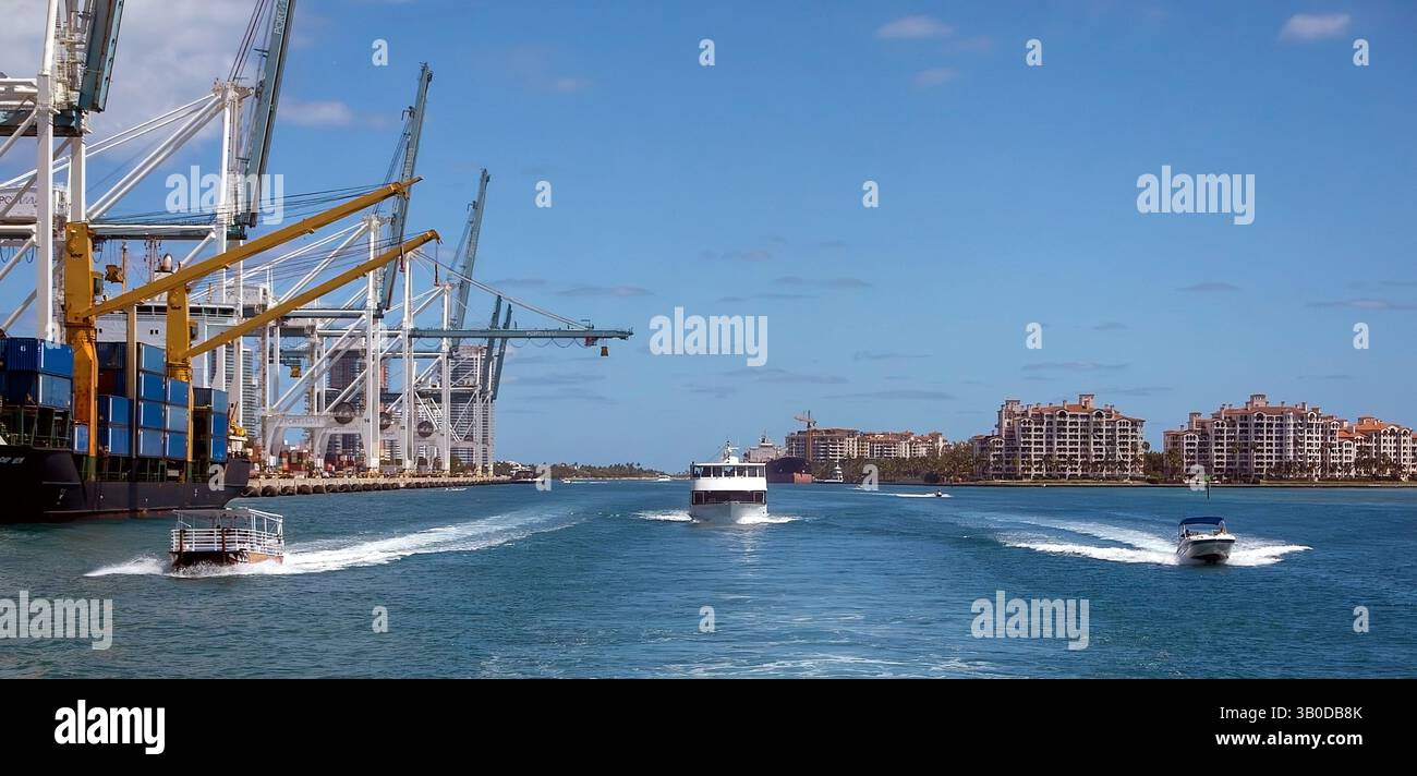 Boats and container cargo cranes in Miami harbour, Miami, Florida, USA ...