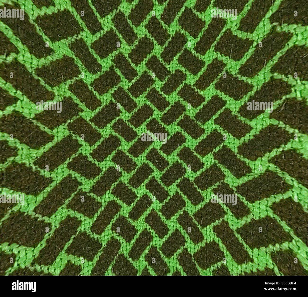 A vibrant green surface adorned with a textured pattern resembling ...