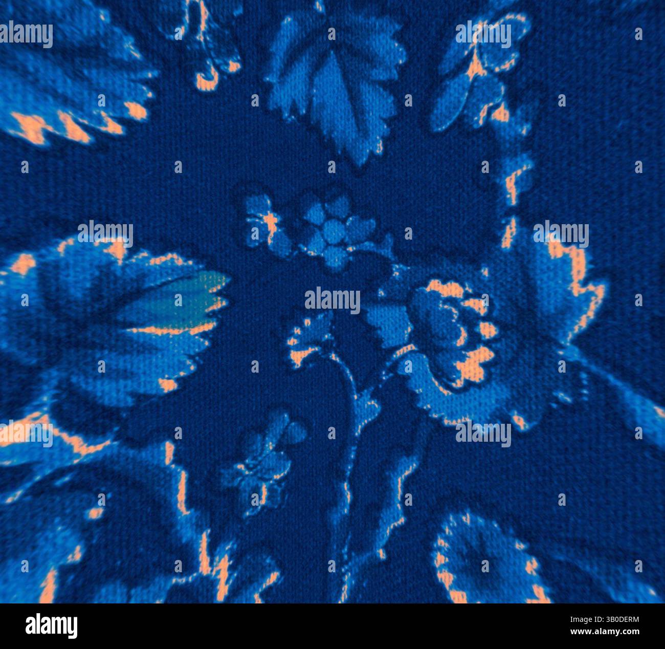 A detailed floral pattern features bold blue flowers and leaves ...