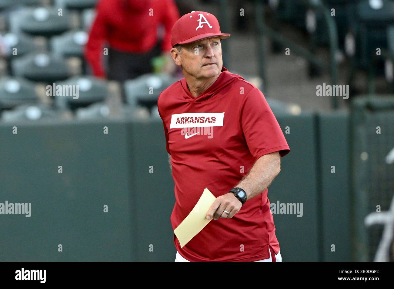 Arkansas coach Dave Van Horn walks back to the dug out before the start of the Razorbacks game ...