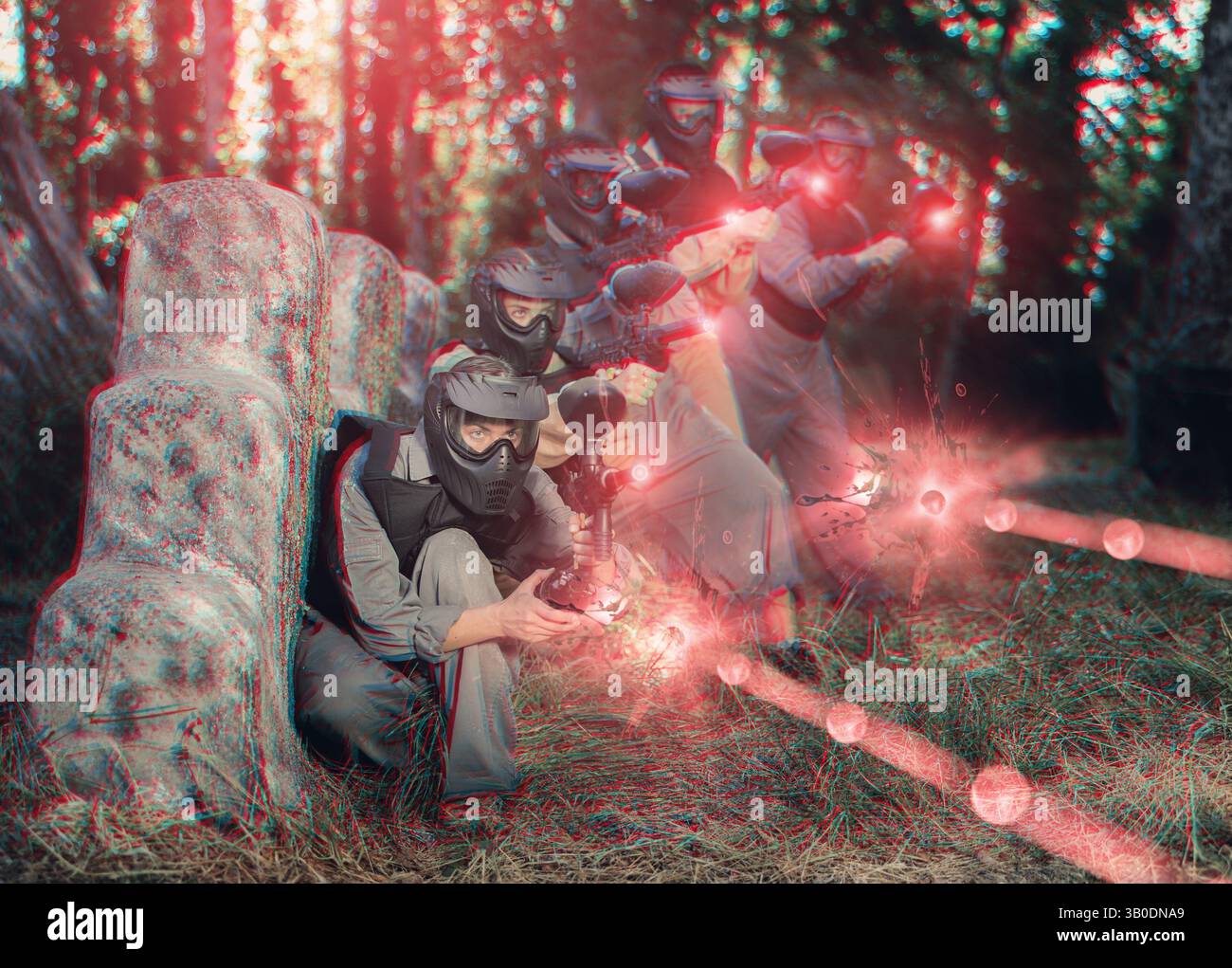 Tactical paintball team fighting on outdoor location Stock Photo - Alamy