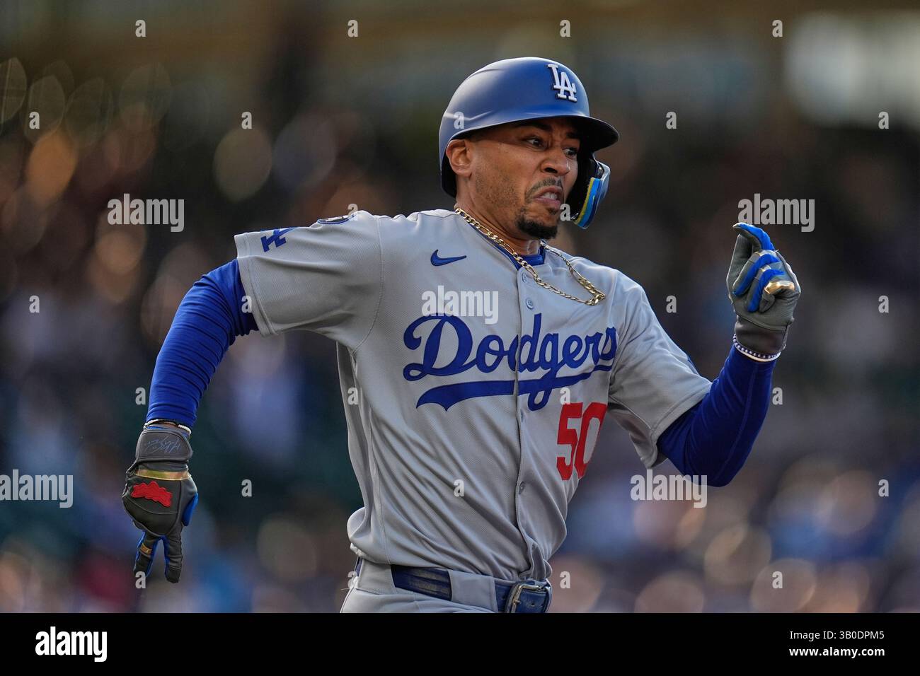 Los Angeles Dodgers Mookie Betts (50) runs the bases after hitting a ...