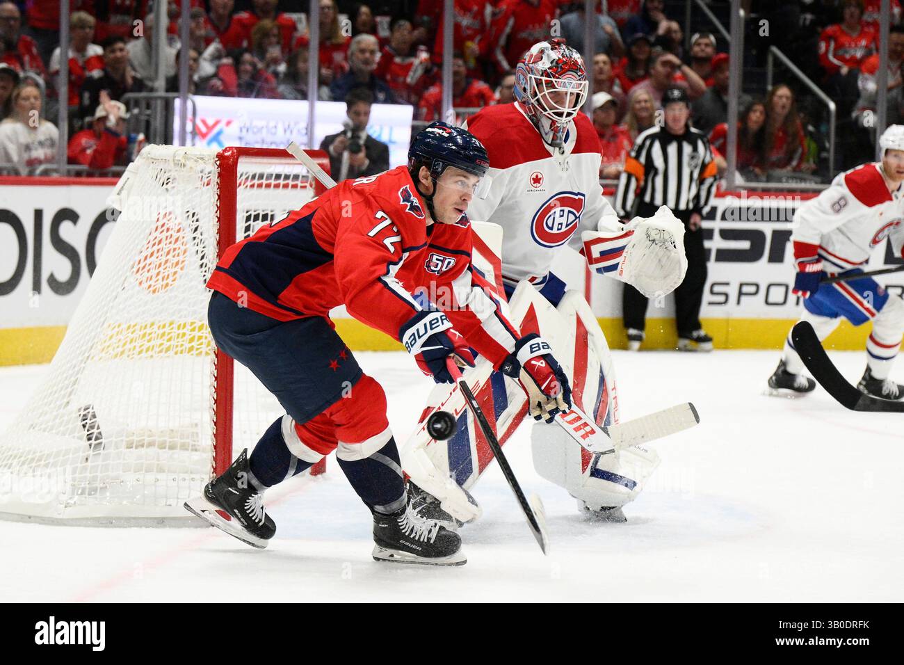 Washington Capitals left wing Anthony Beauvillier (72) reaches for the ...