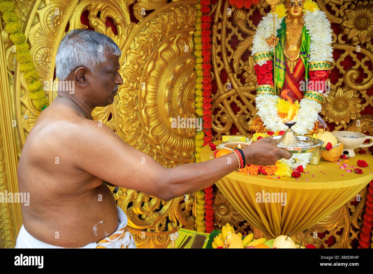 Penang, Malaysia - February 8, 2025: A Hindu priest performs a ritual ...