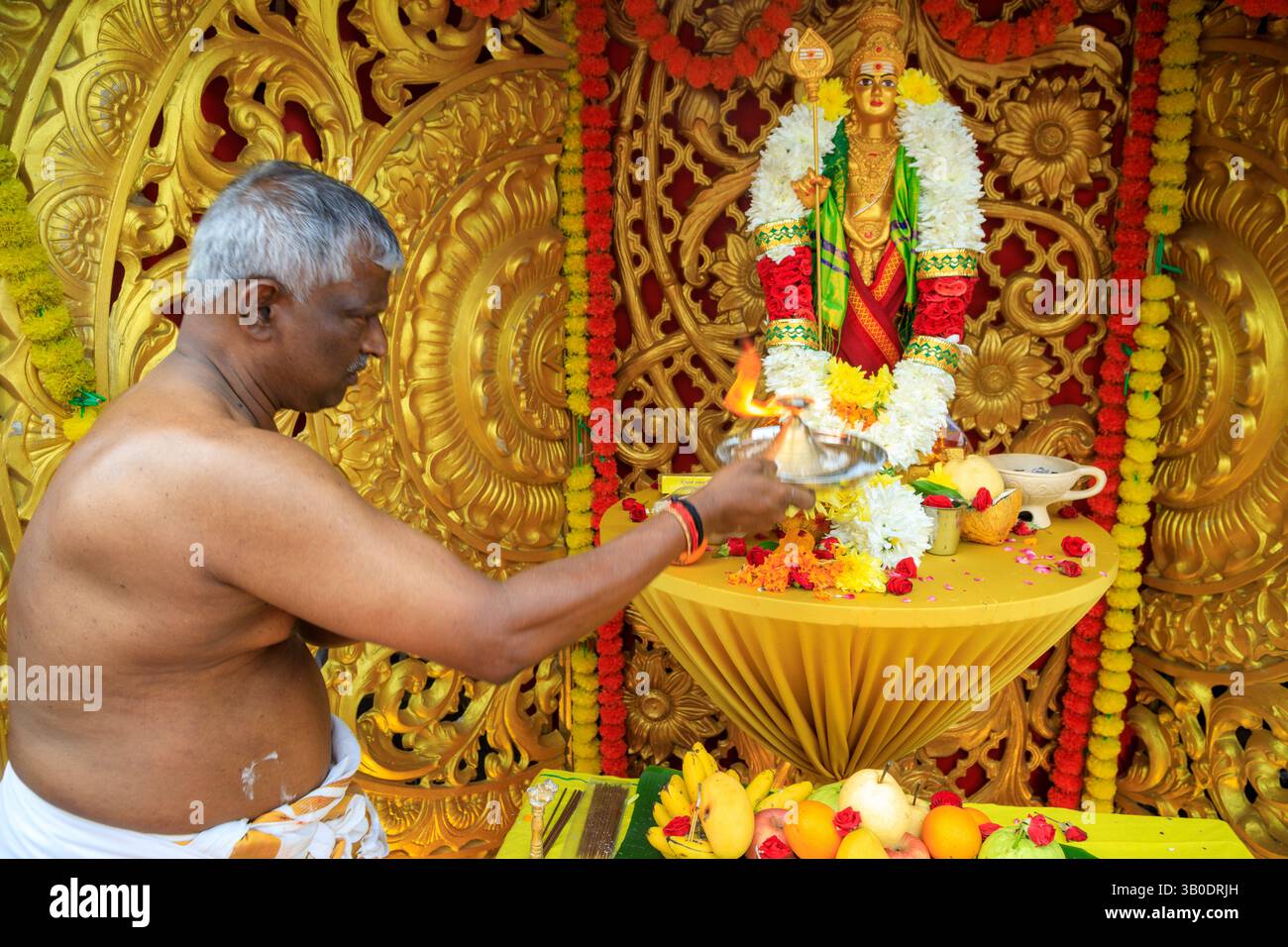 Penang, Malaysia - February 8, 2025: A Hindu priest performs a ritual ...