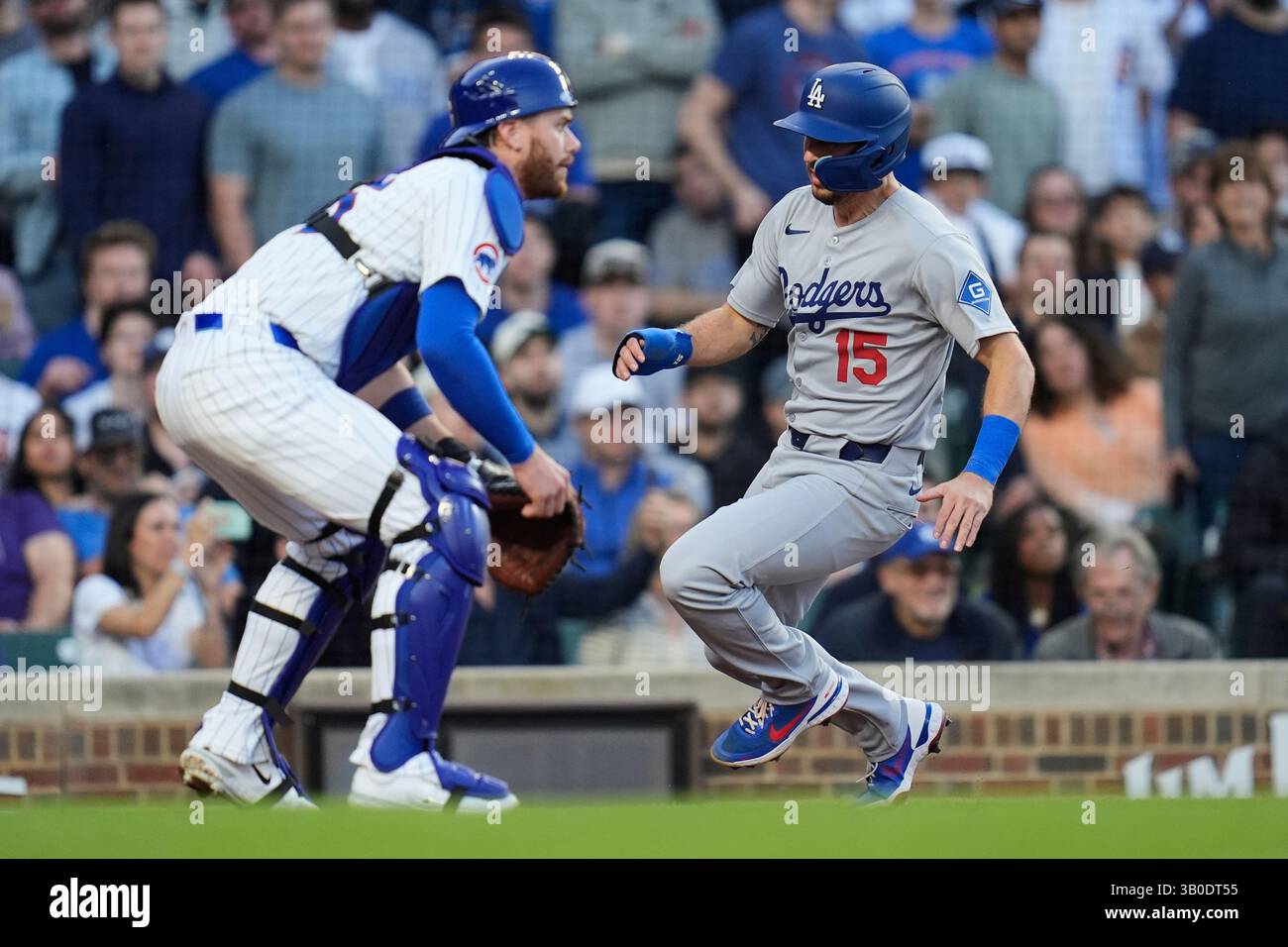 Los Angeles Dodgers' Austin Barnes (15), right, slides by Chicago Cubs ...
