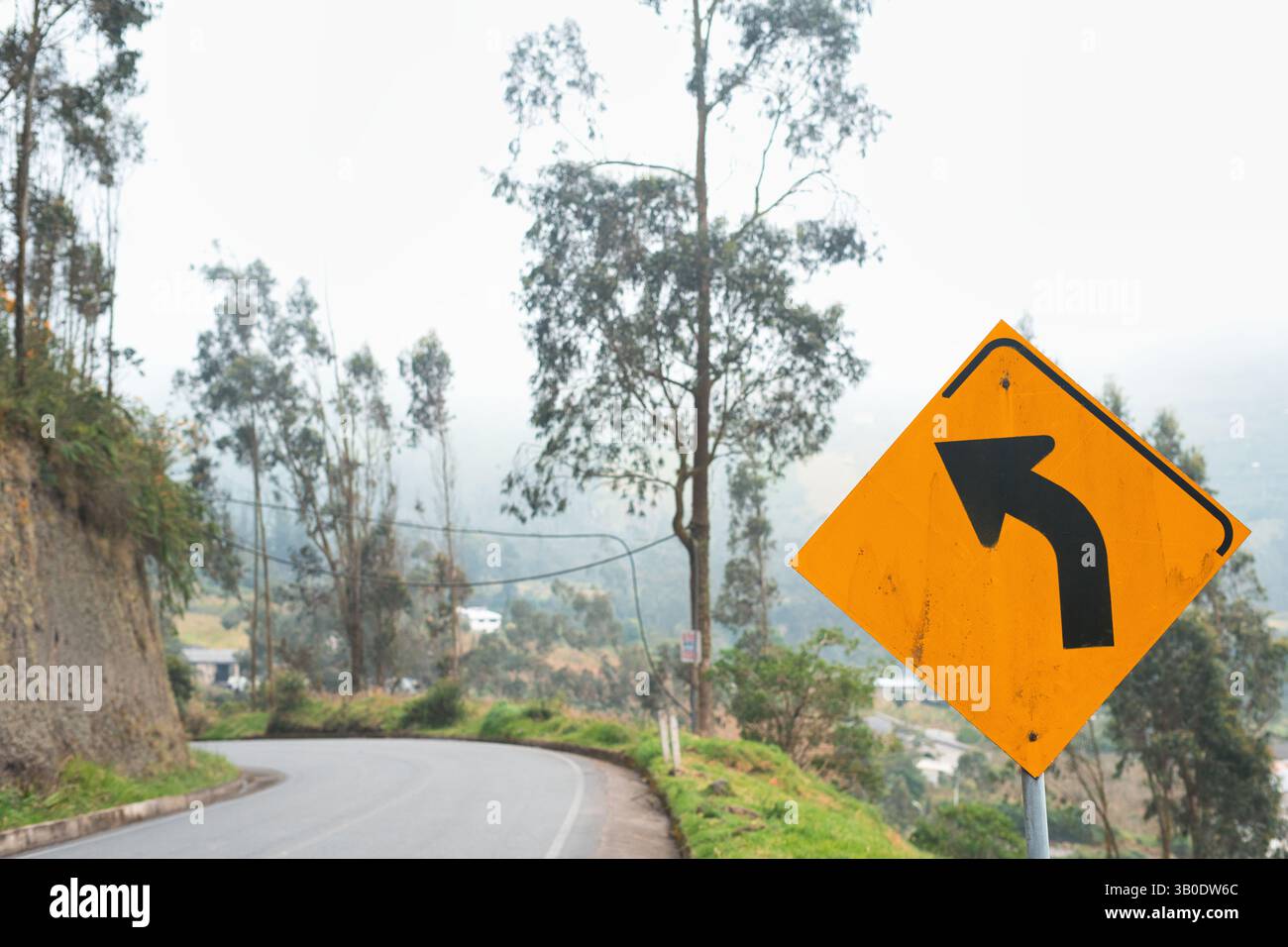 A Beautiful Winding Road Featuring a Curved Traffic Sign Surrounded by ...