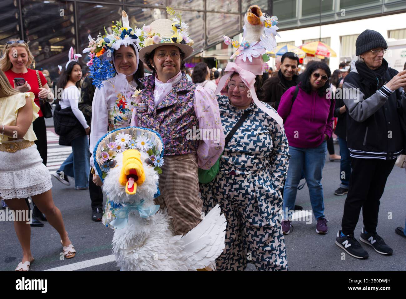 A group of people wearing elaborate Easter bonnets and costumes participate in an Easter parade ...