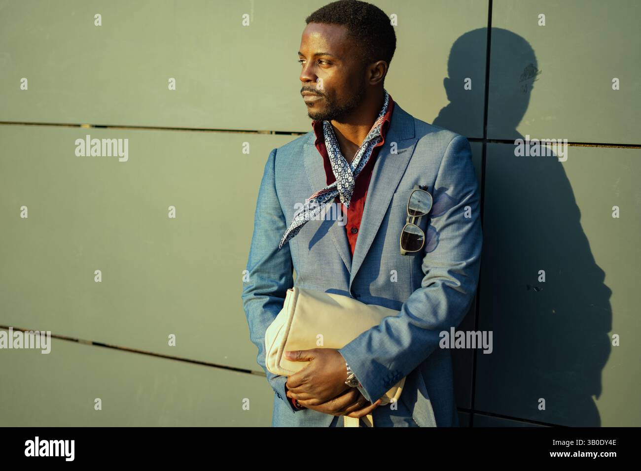 A Stylish Man Dressed in a Smart Blue Suit with Accessories Poses ...
