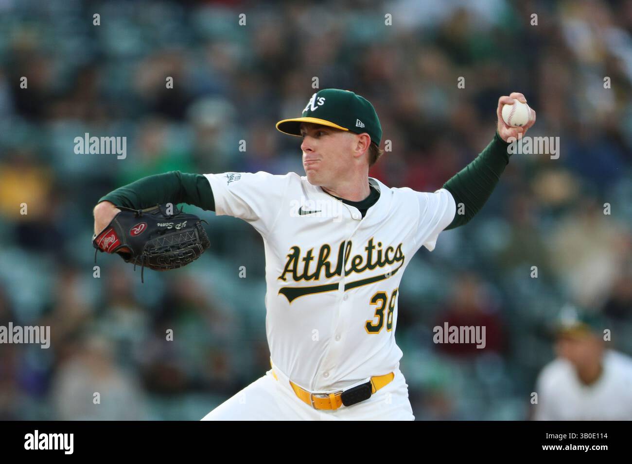 Athletics pitcher JP Sears (38) throws a pitch to a Texas Rangers ...