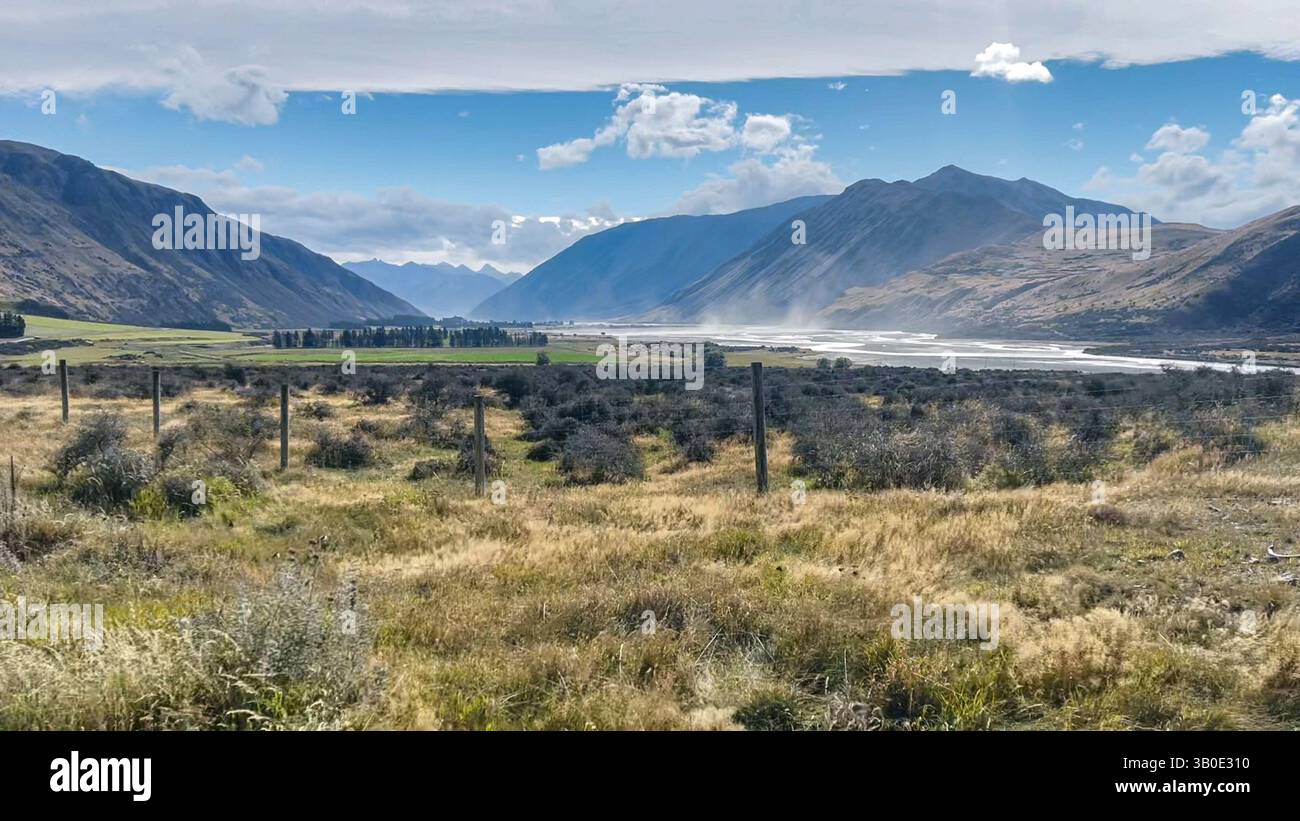 Surrounded by mountain ranges the extreme arid dry farming fields in ...
