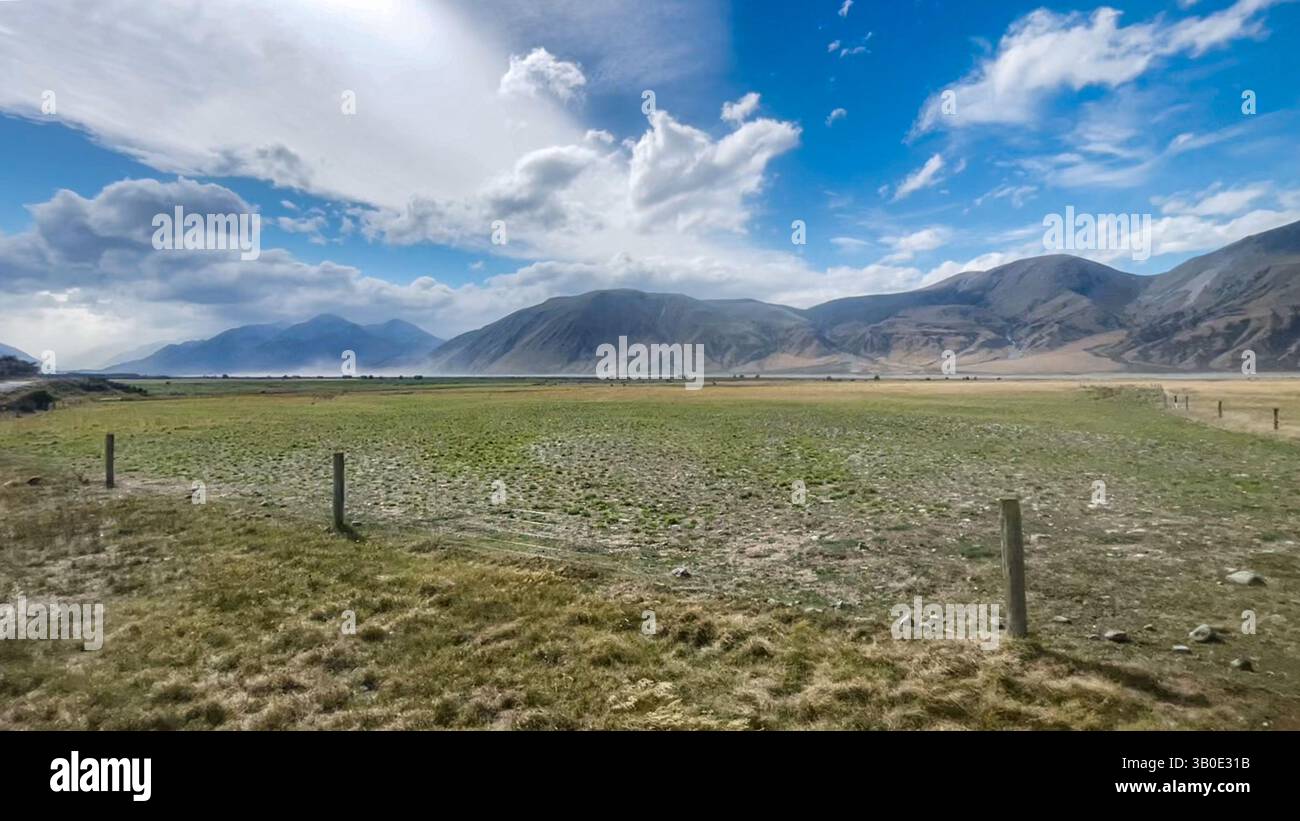 Surrounded by mountain ranges the extreme arid dry farming fields in ...