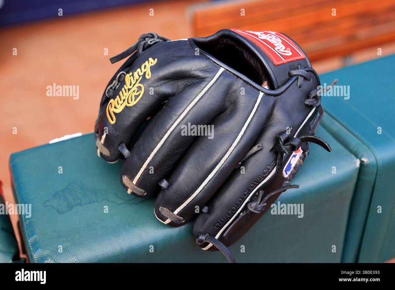 ATLANTA, GA - APRIL 21: A Rawlings baseball glove on the dugout rail before the Monday evening ...