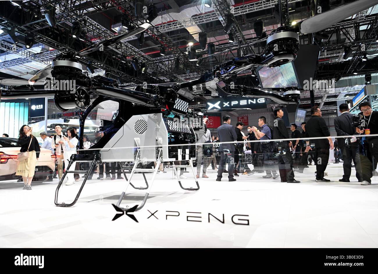 XPeng automobiles and humanoid robot attract visitors at the Auto ...
