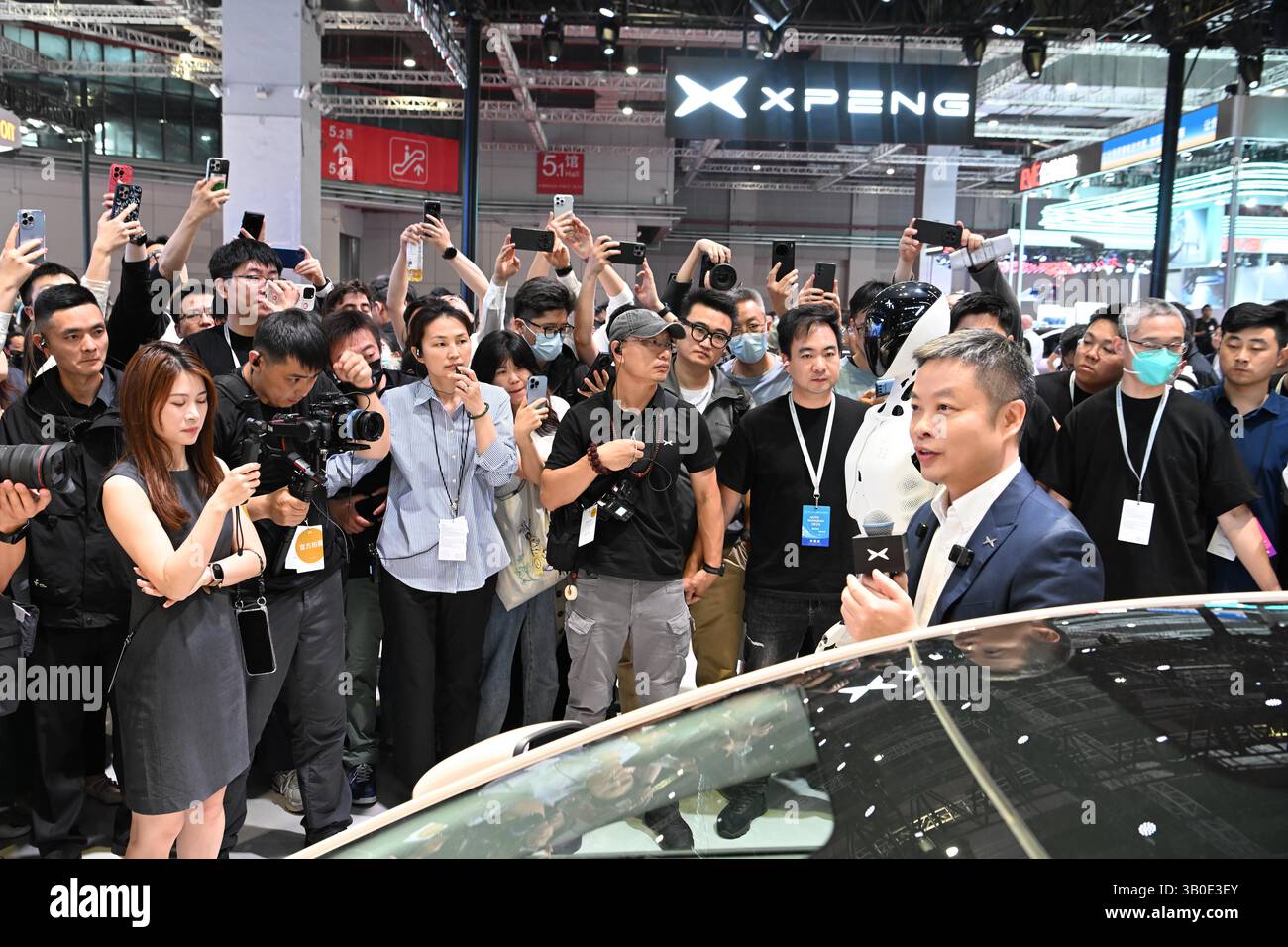 XPeng automobiles and humanoid robot attract visitors at the Auto ...