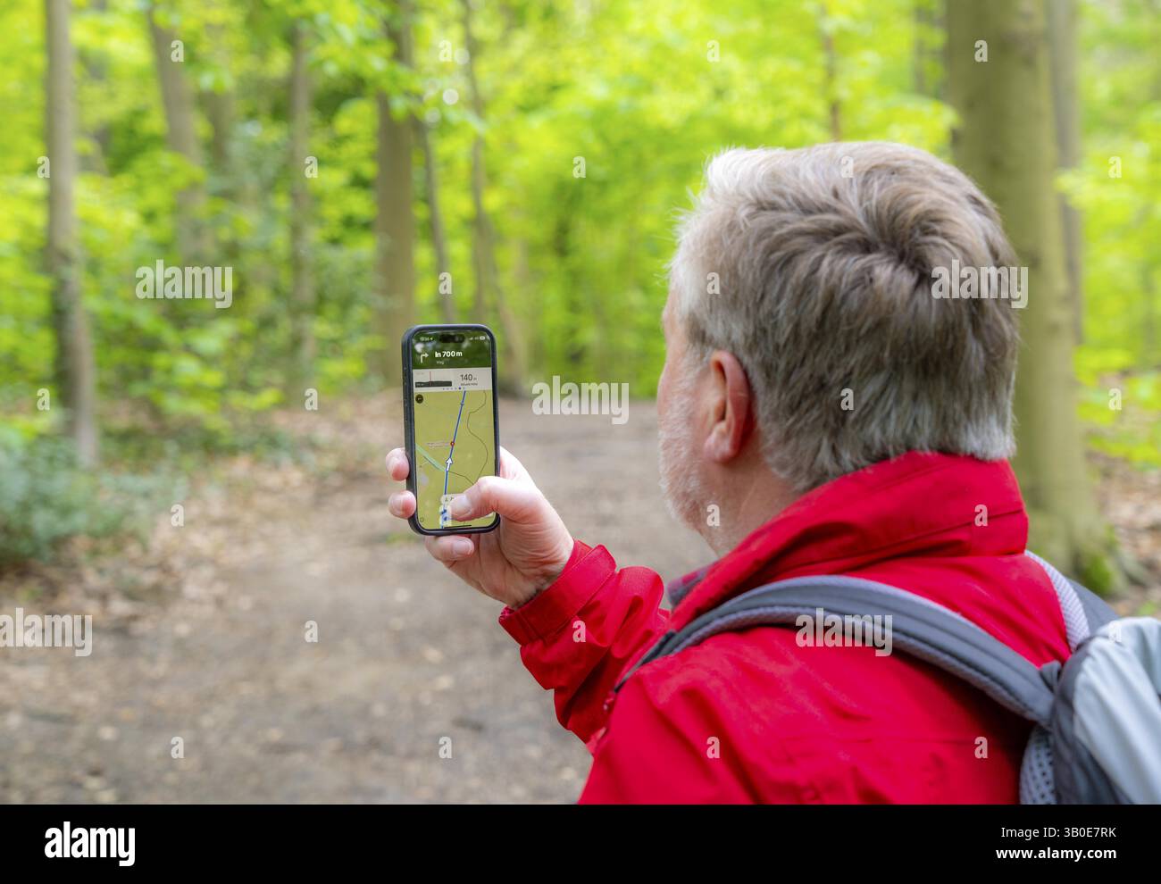 Symbolic image Hiking with smartphone and hiking app, navigation on ...