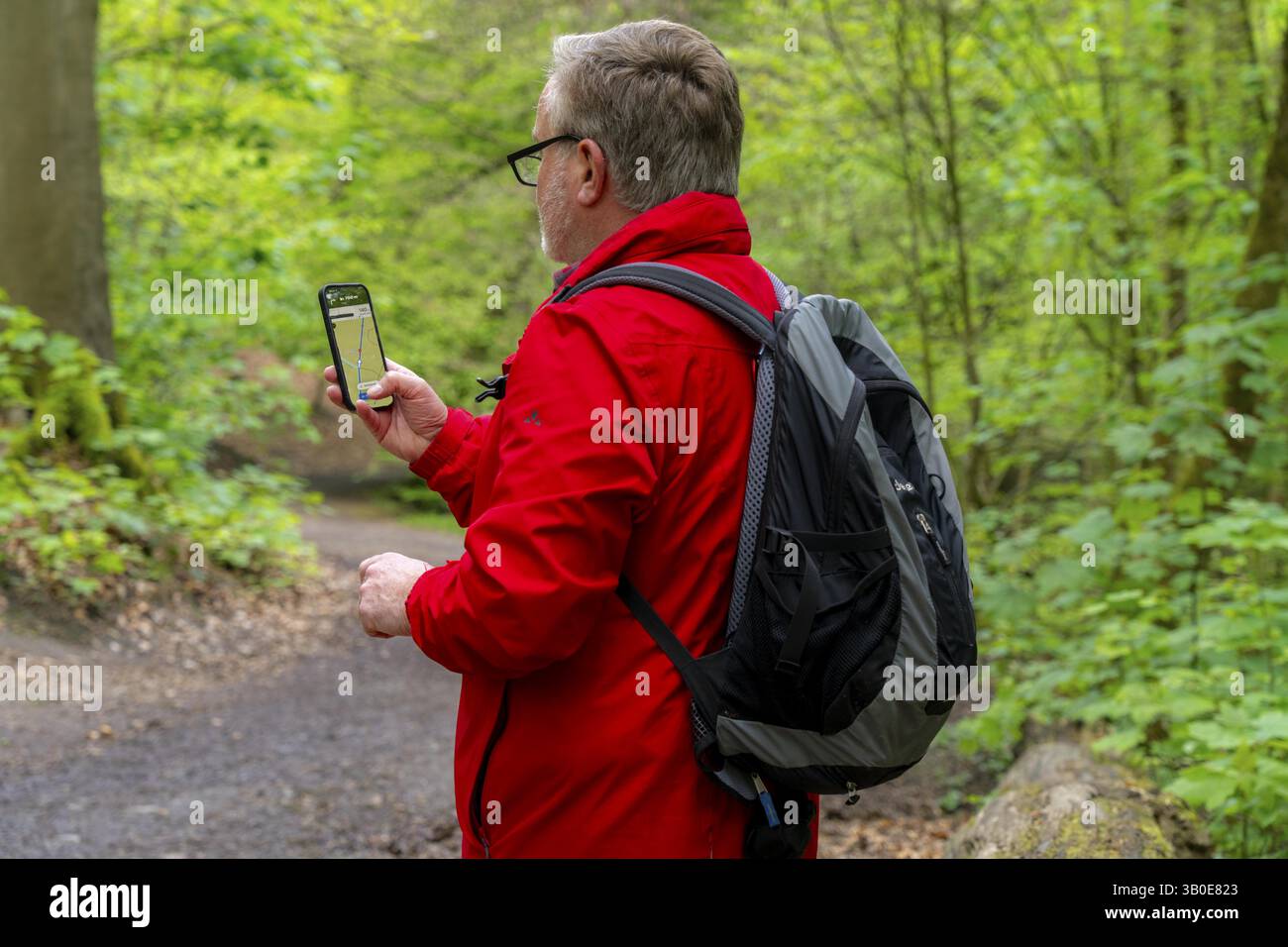 Symbolic image Hiking with smartphone and hiking app, navigation on ...