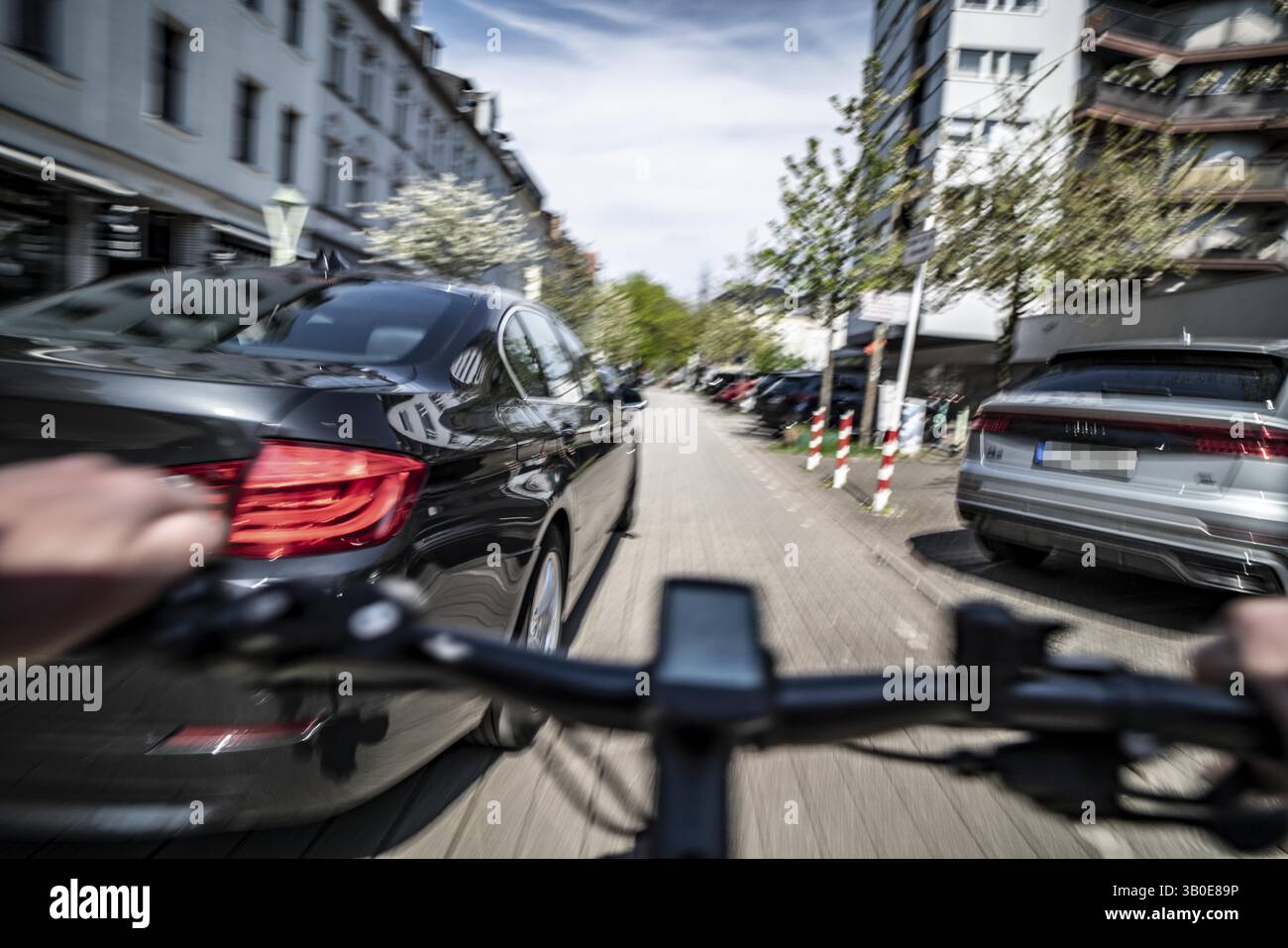 Cars overtake cyclists without leaving much distance, cycling in the ...