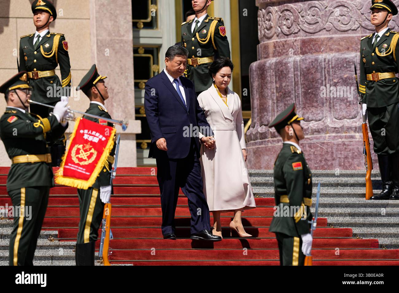 Chinese President Xi Jinping, center left, and his wife Peng Liyuan ...
