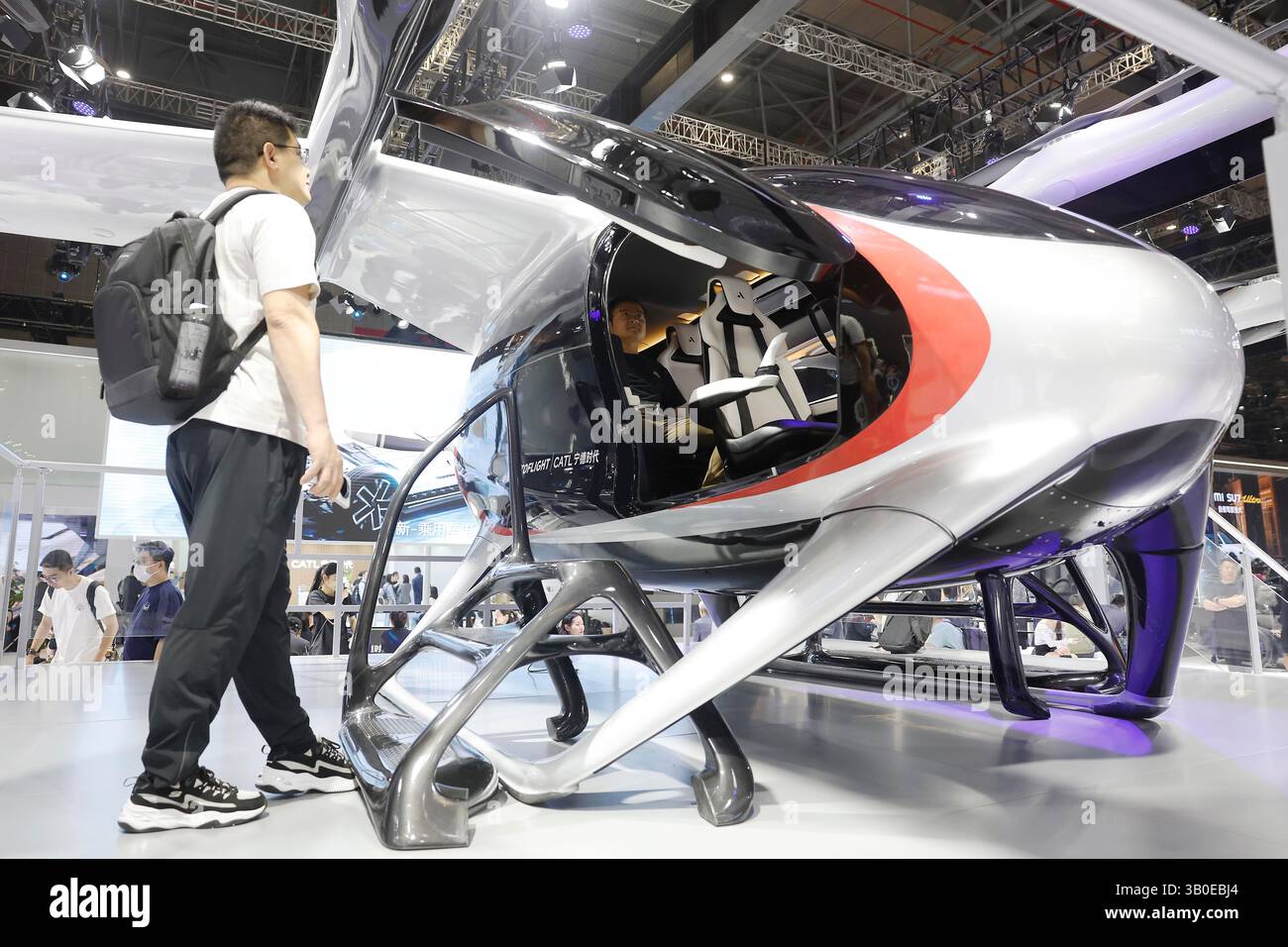 Shanghai,China.23rd April 2025. A visitor tries Autoflight's 2-ton ...