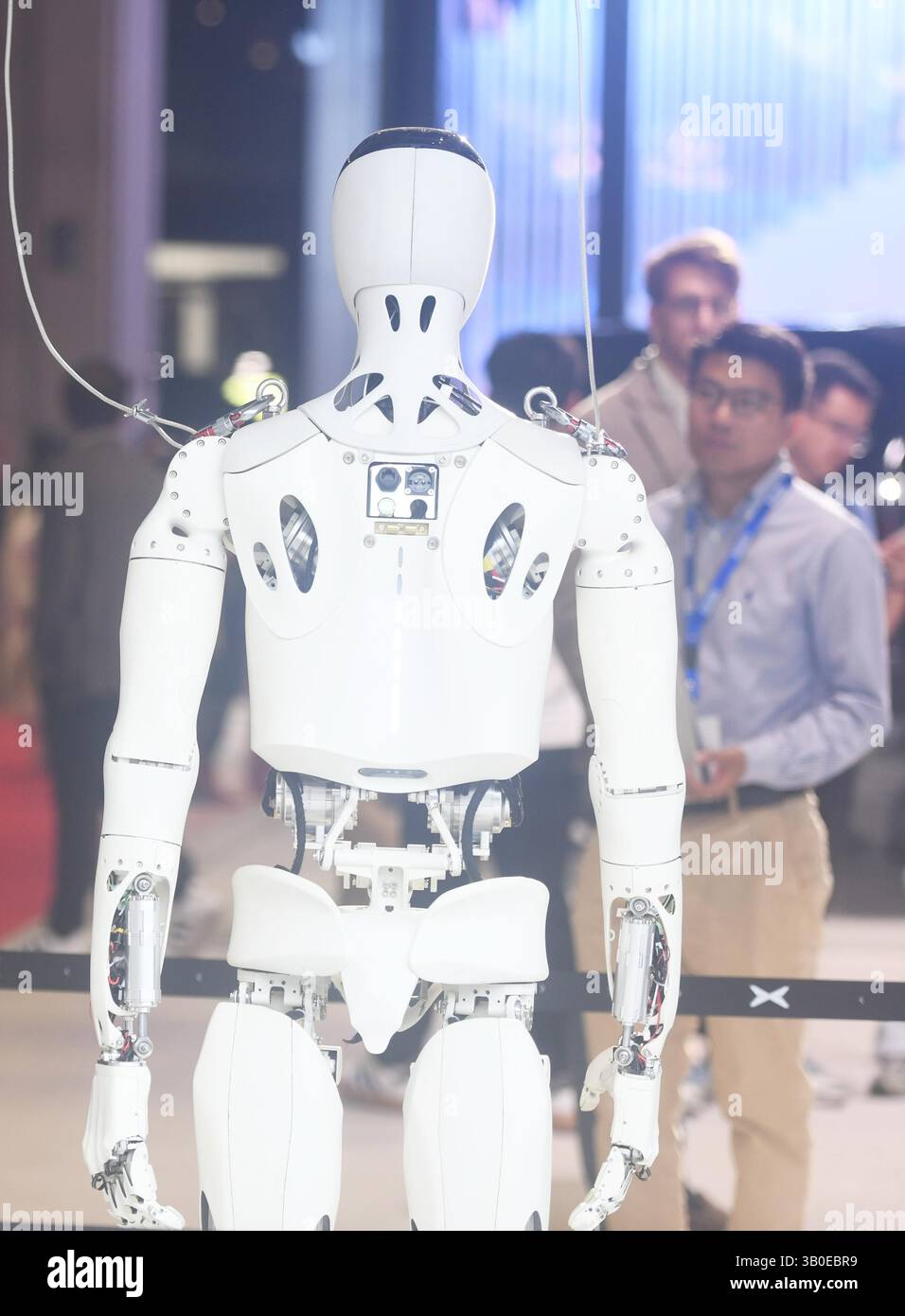 People watch the Xpeng's humanoid robot "IRON" at the Auto Shanghai ...