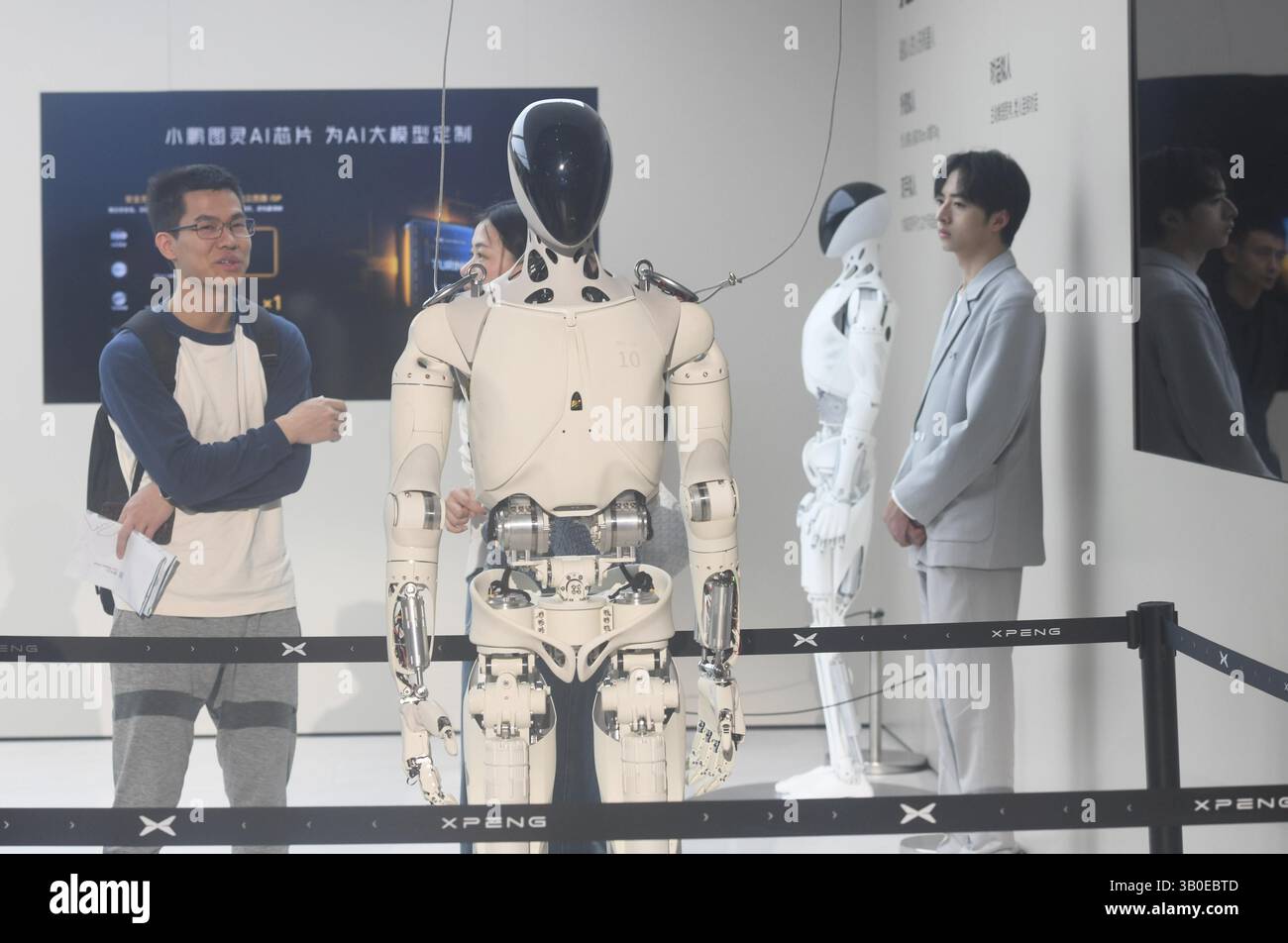 People watch the Xpeng's humanoid robot "IRON" at the Auto Shanghai 2025, Shanghai, China, 23 ...