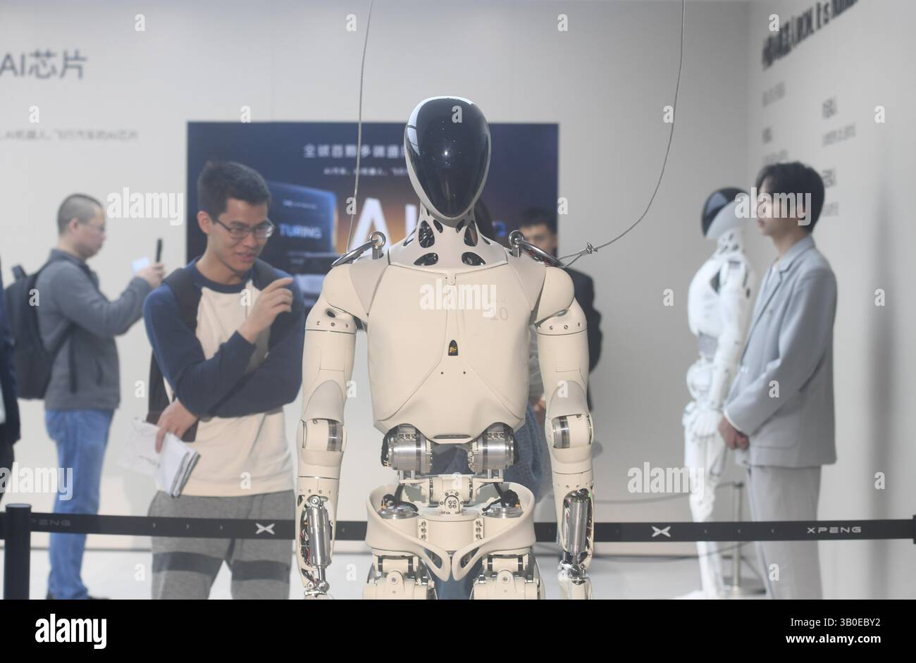 People watch the Xpeng's humanoid robot "IRON" at the Auto Shanghai 2025, Shanghai, China, 23 ...