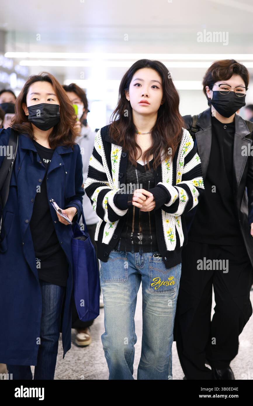 Chinese singer and actress Yu Yan appears at the airport in Shanghai ...