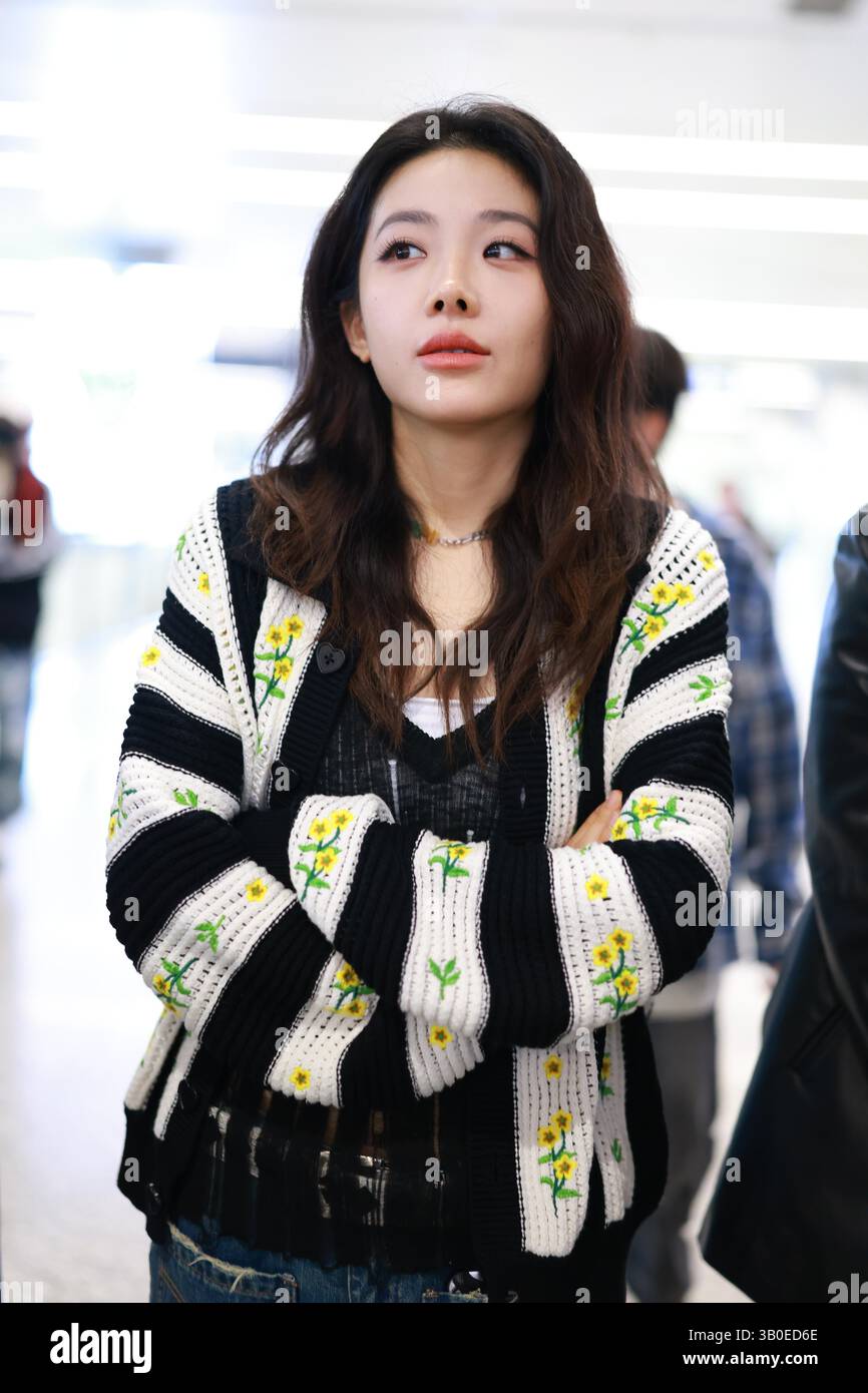 Chinese singer and actress Yu Yan appears at the airport in Shanghai ...