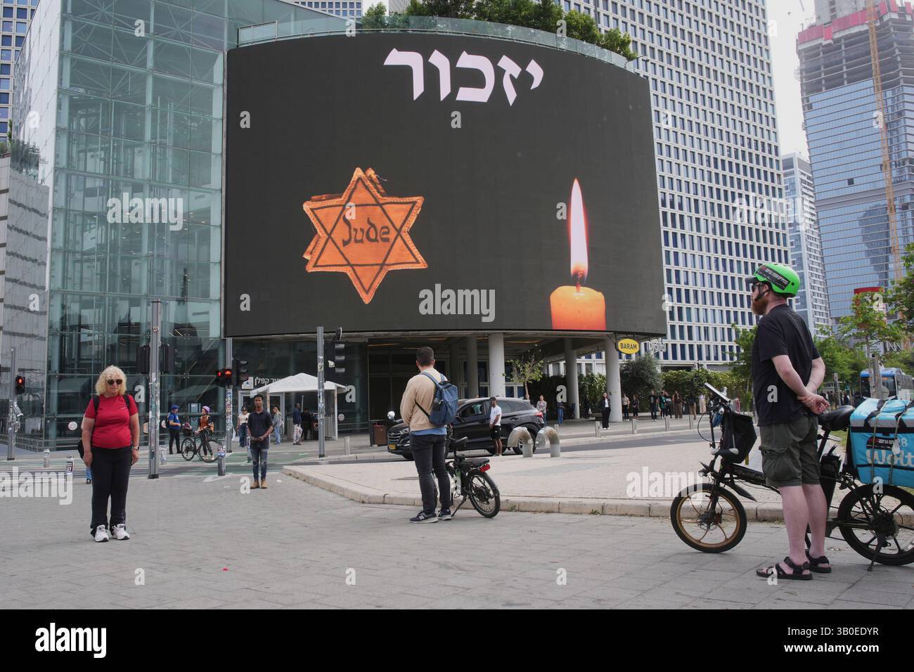 People stand during a two-minute siren marking the annual Israeli ...