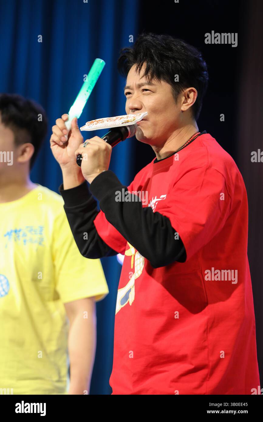 Chinese singer and actor Zeng Yi attends an activity in Shenyang City, northeast China's ...