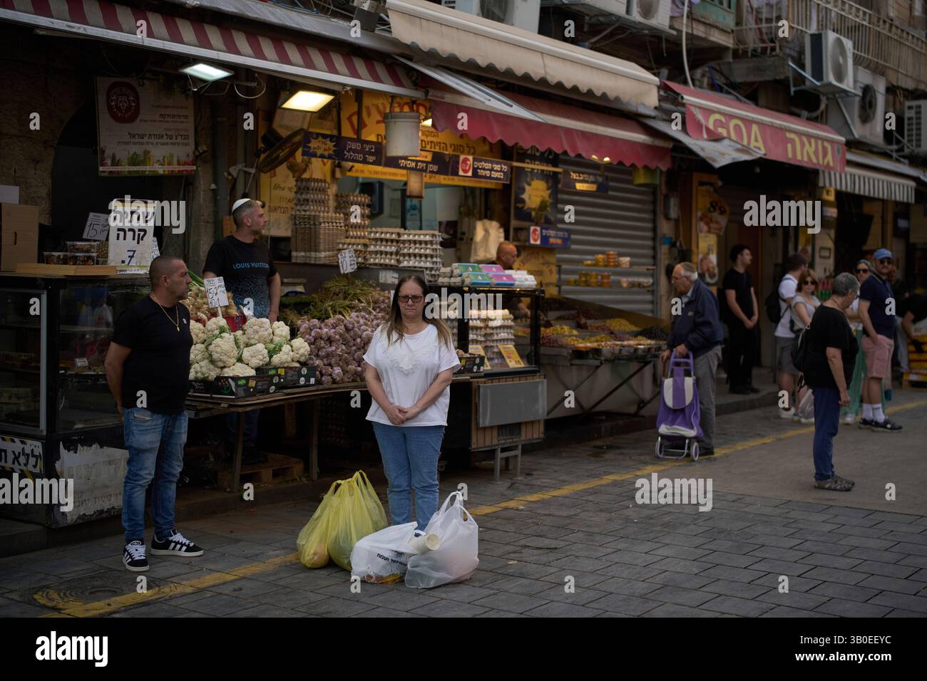 People stand still during a two-minute siren marking the annual Israeli ...