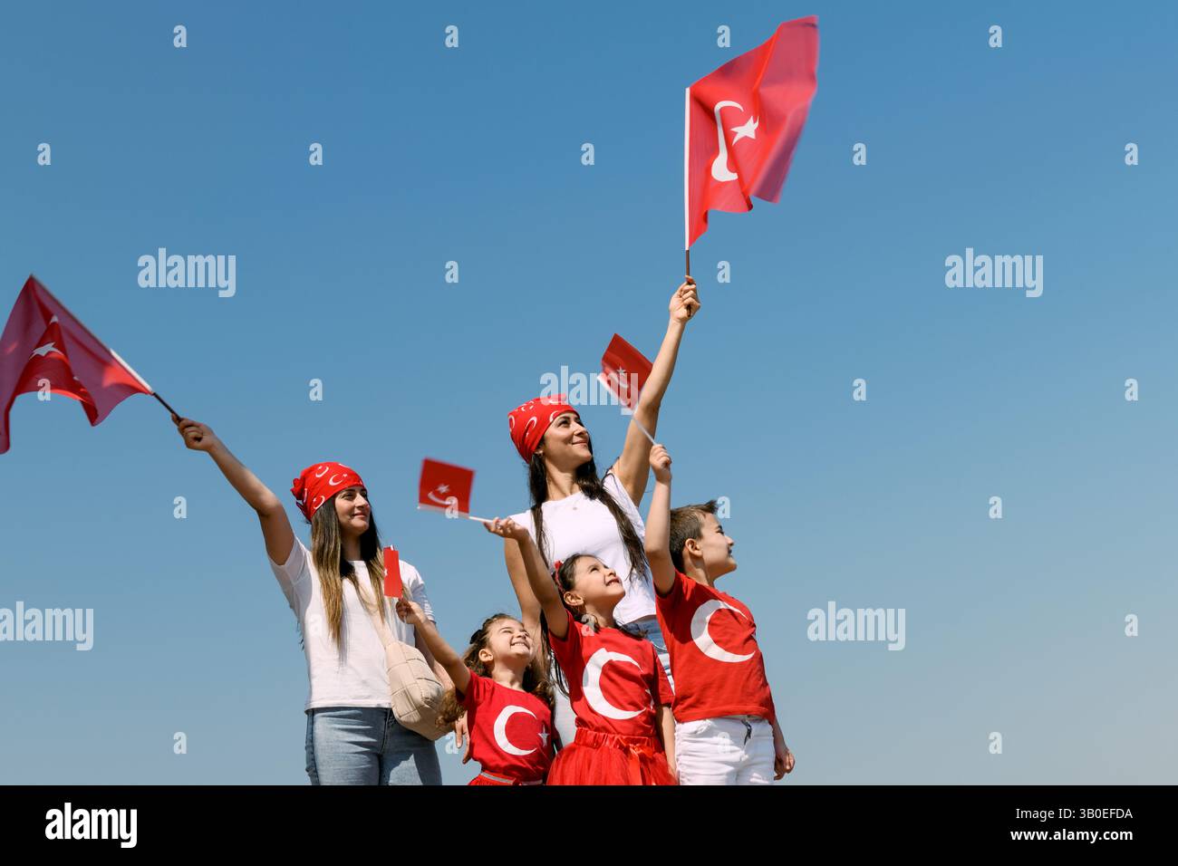 Izmir, Turkey - Apr 23 2025: Two mothers and three children smile and ...