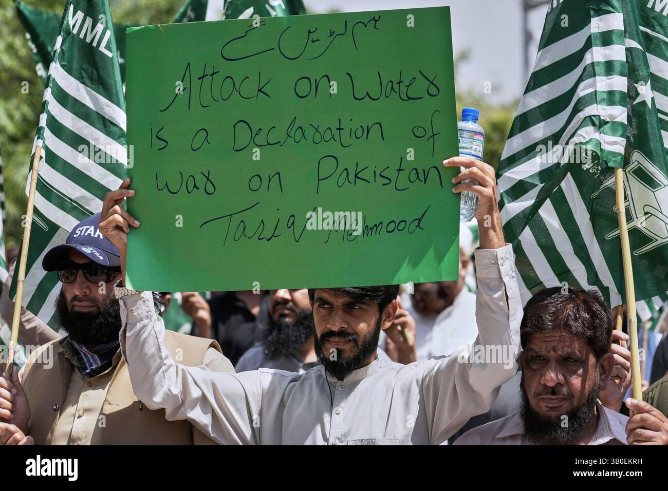 Supporters of the Pakistan Murkazi Muslim League party hold a ...